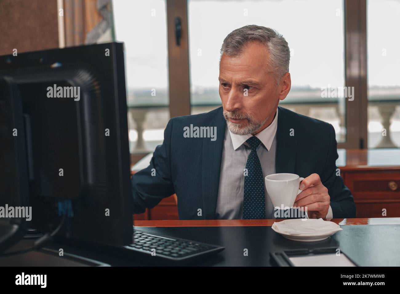 Elegant mature hotel manager in hi-res stock photography and images - Alamy