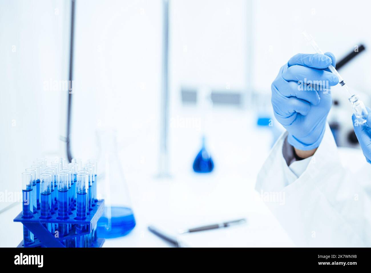 background image of a laboratory assistant in a medical laboratory ...