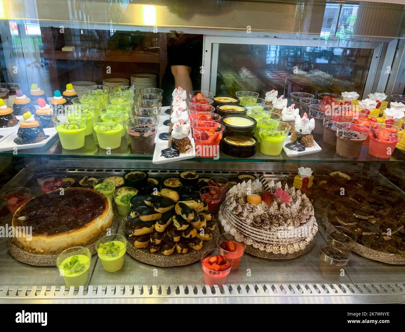 Sweet desserts behind the glass in cafe, sale. Studio Photo Stock Photo ...
