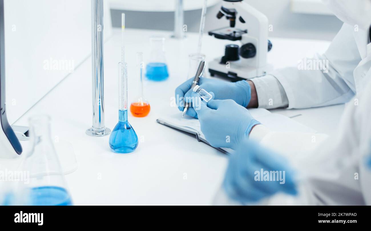 close up. group of scientists sitting at a laboratory table Stock Photo ...
