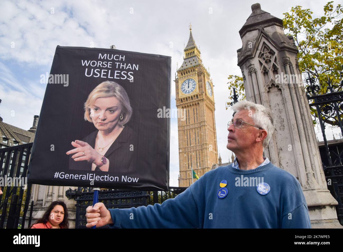 London, UK. 19th October 2022. A protester holds an anti-Liz Truss ...