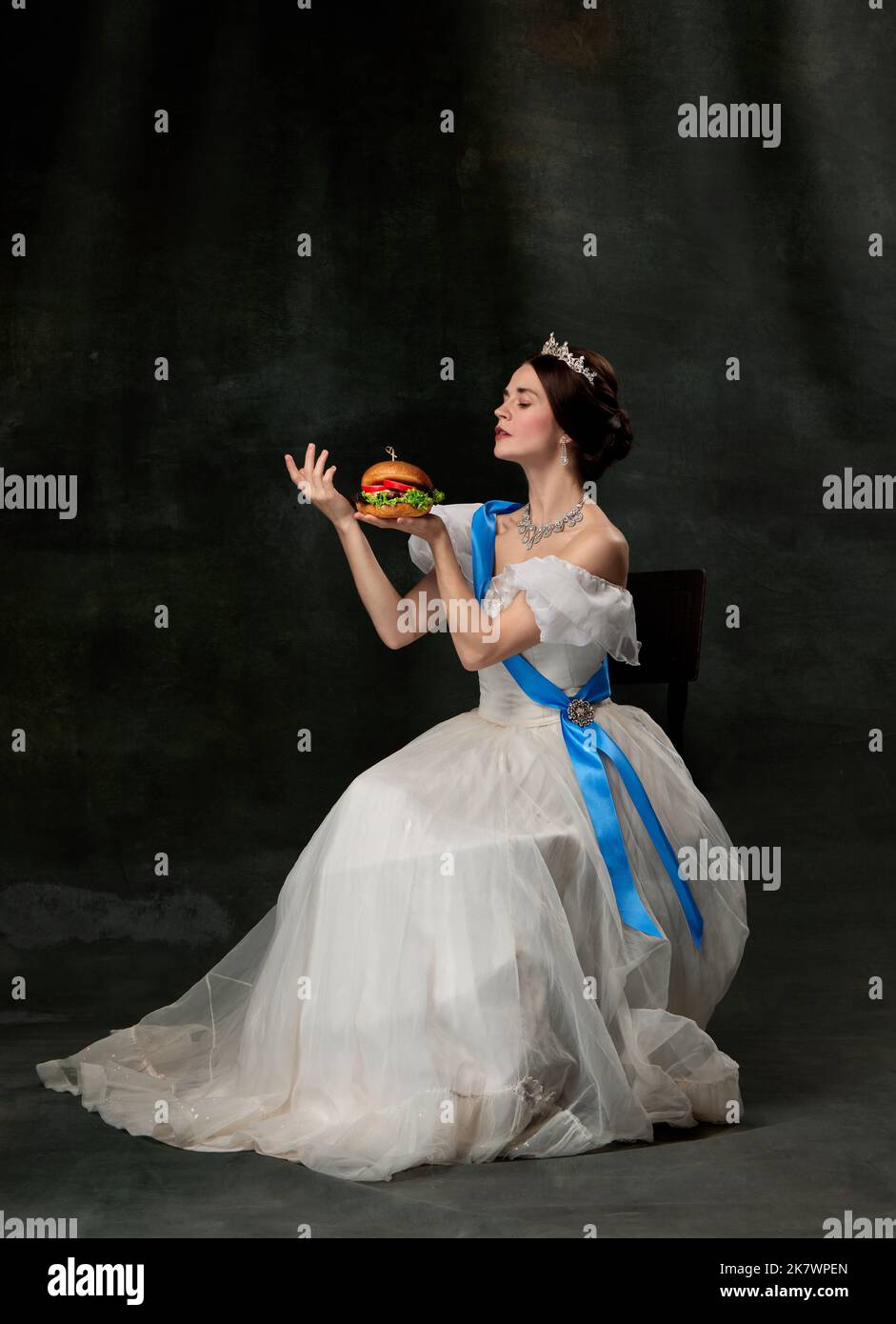 Refined taste. Young beautiful queen or princess in white medieval ...