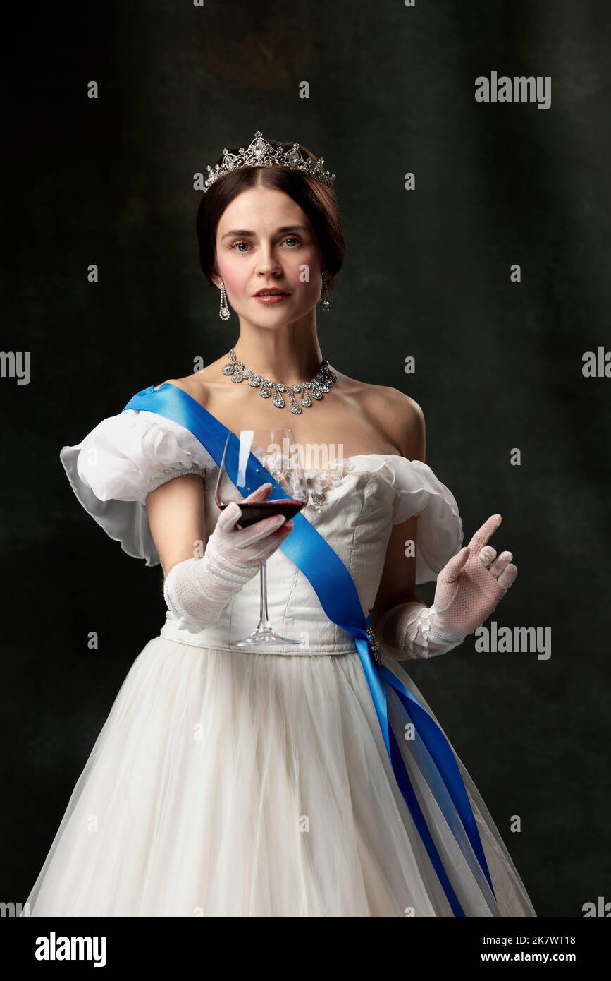 Queen invites for tasting. Young charming girl in image of medieval ...