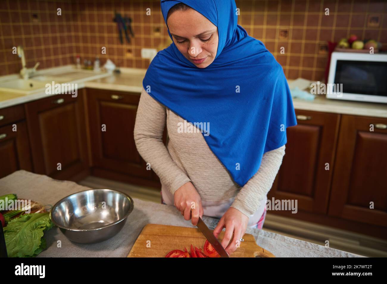 Beautiful Middle Eastern Muslim woman, pretty housewife in blue hijab ...