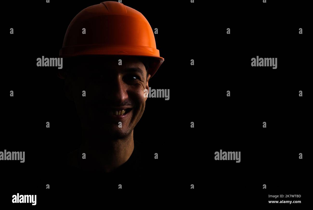 Dirty face of coal miner on a black background. Head of tired mine ...