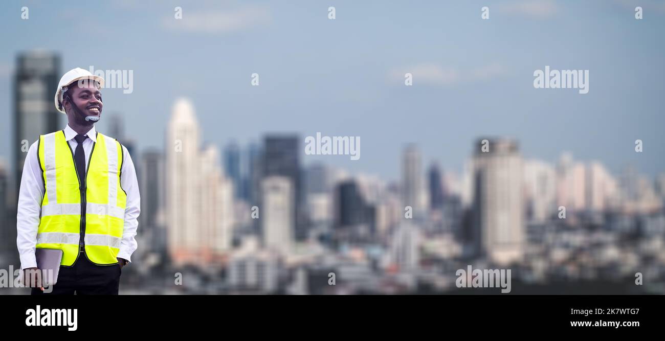 African architect engineer man with white safety helmet standing at ...