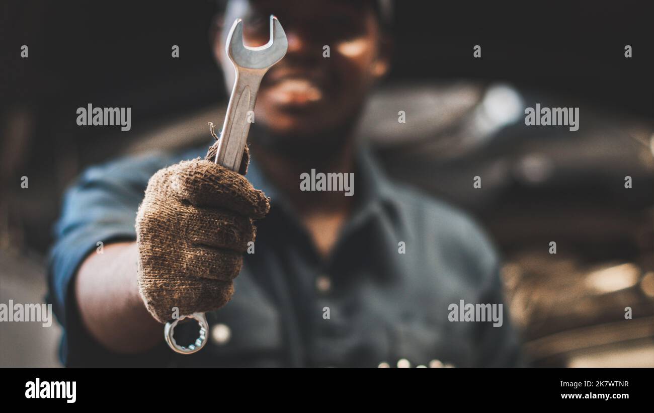 African maintenance male holding screw driver for checking car,service ...