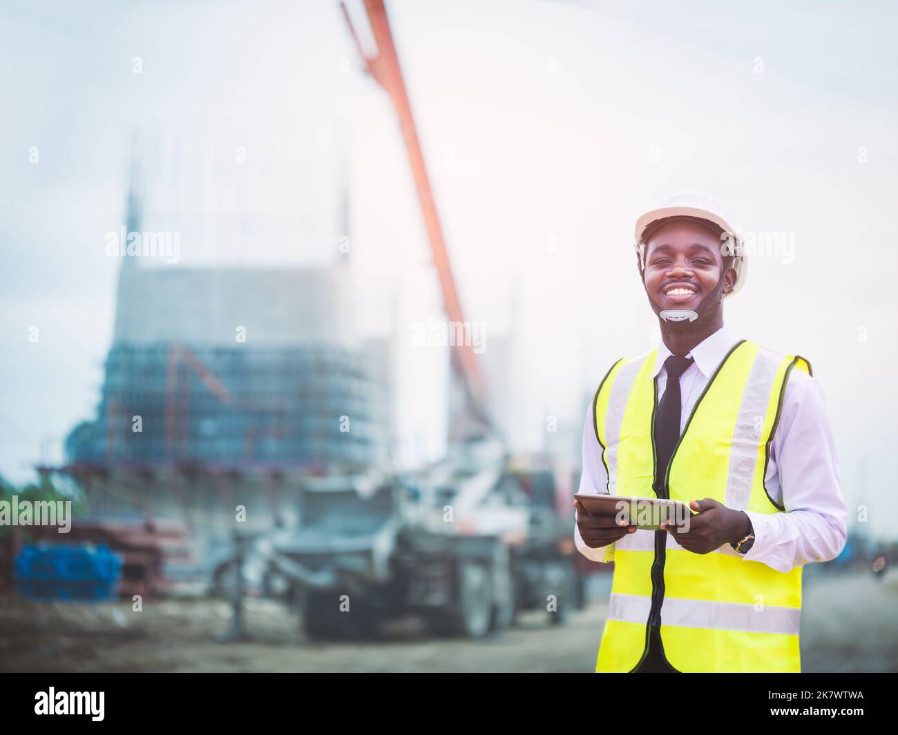 African civil engineering working with use tablet for control the road ...