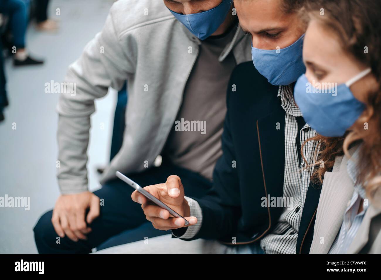 group of young people looking at the smartphone screen Stock Photo - Alamy