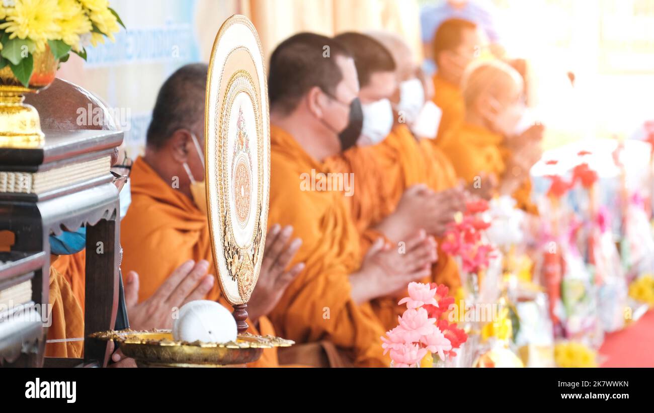 Monks in mask pray and pay respect to Buddhist ceremonies Stock Photo ...