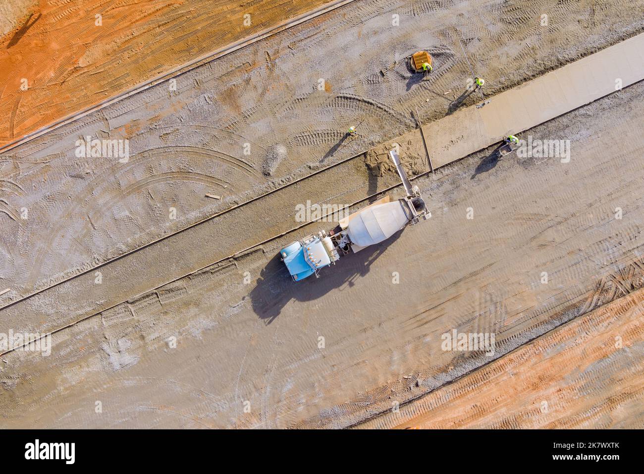 At newly construction site on sidewalk that was paved, an employee of ...