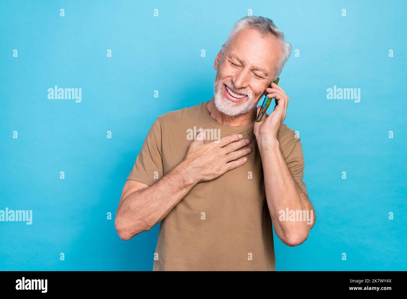Photo of cheerful candid retired man hand chest eyes closed wear ...