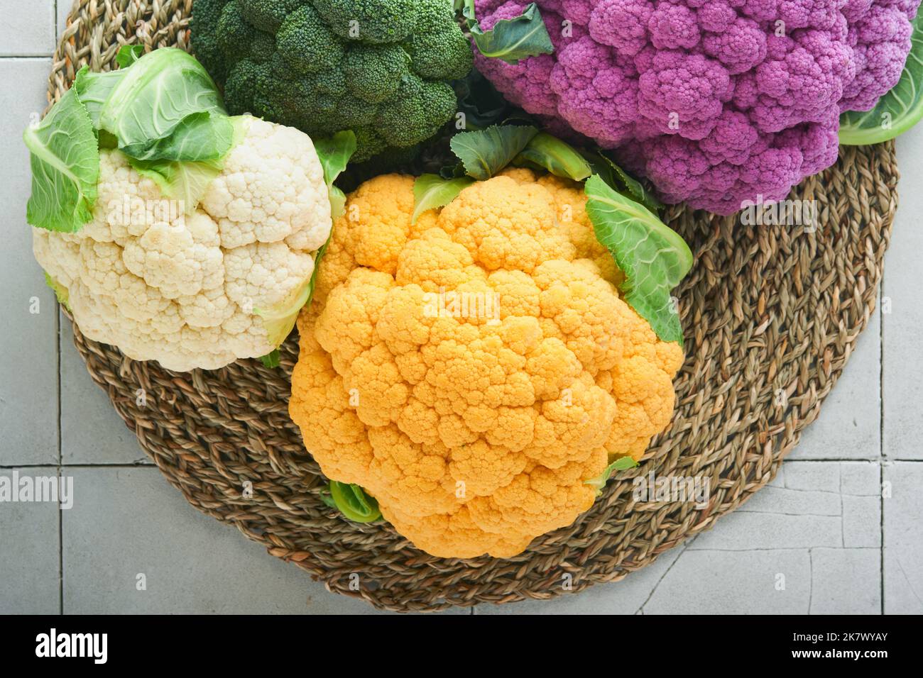 Colorfu cauliflower. Various sort of cauliflower on stone tiles gray ...