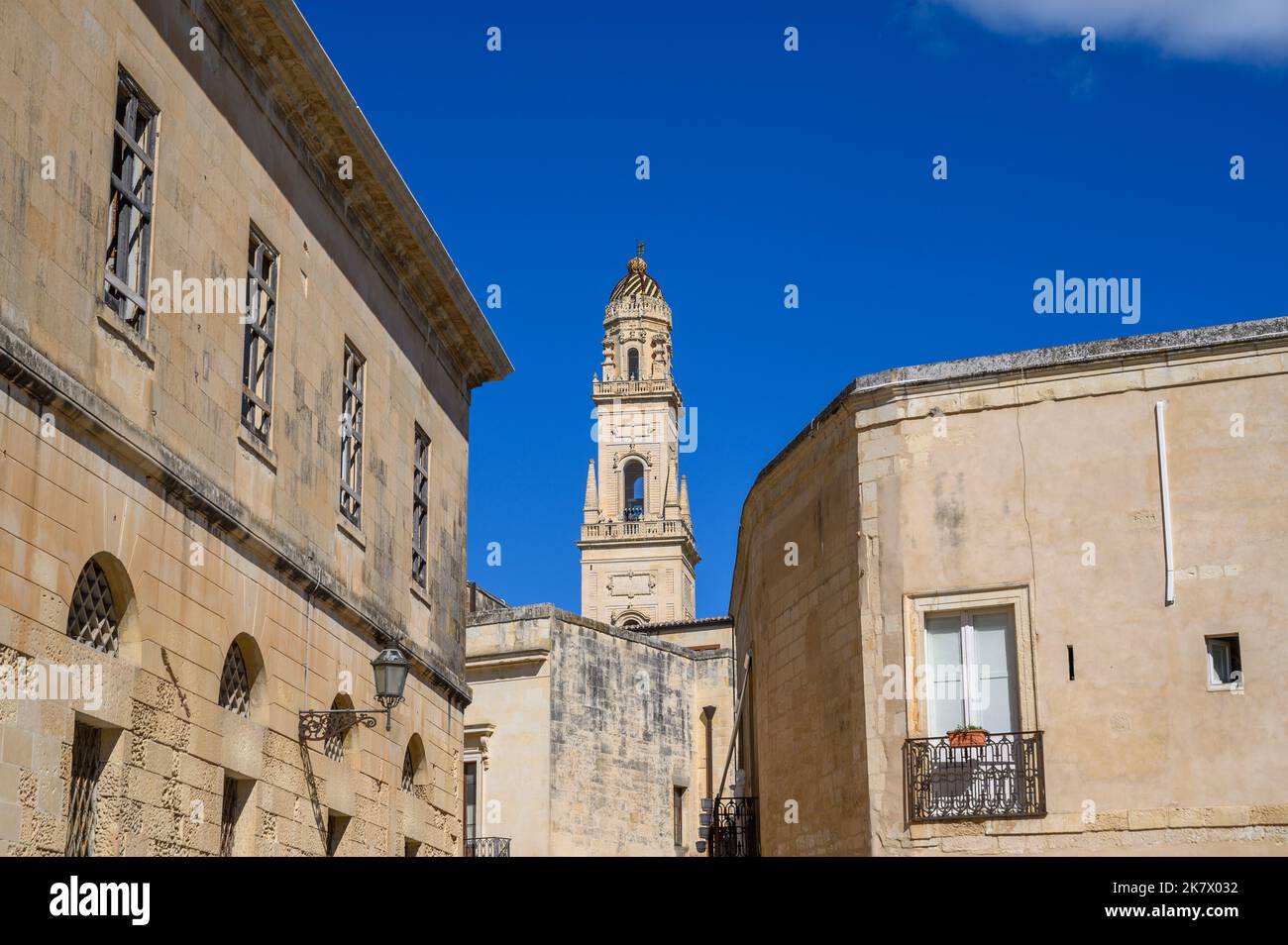 The bell tower of Lecce Cathedral visible behind and in between old ...