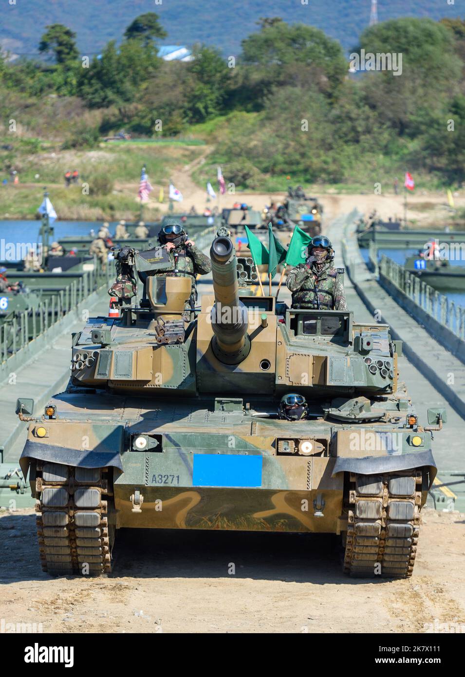 Yeoju, South Korea. 19th Oct, 2022. South Korean Army K-2 tanks cross a ...