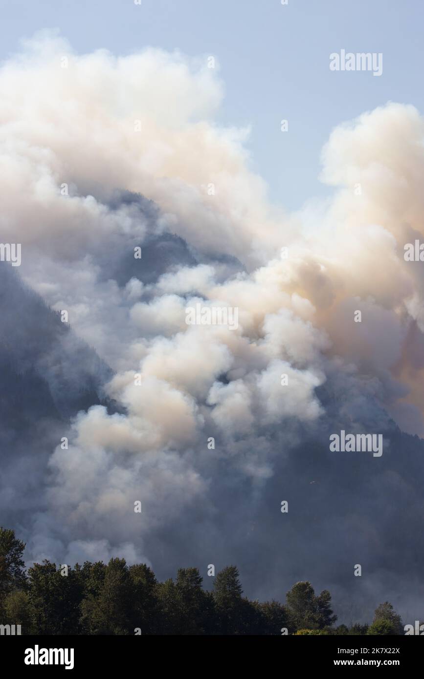 BC Forest Fire and Smoke over the mountain near Hope during a hot sunny ...