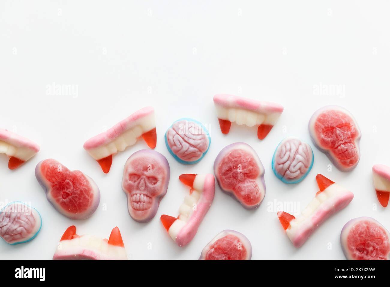 Halloween candy background. Skull, fangs and brain sweets Stock Photo ...
