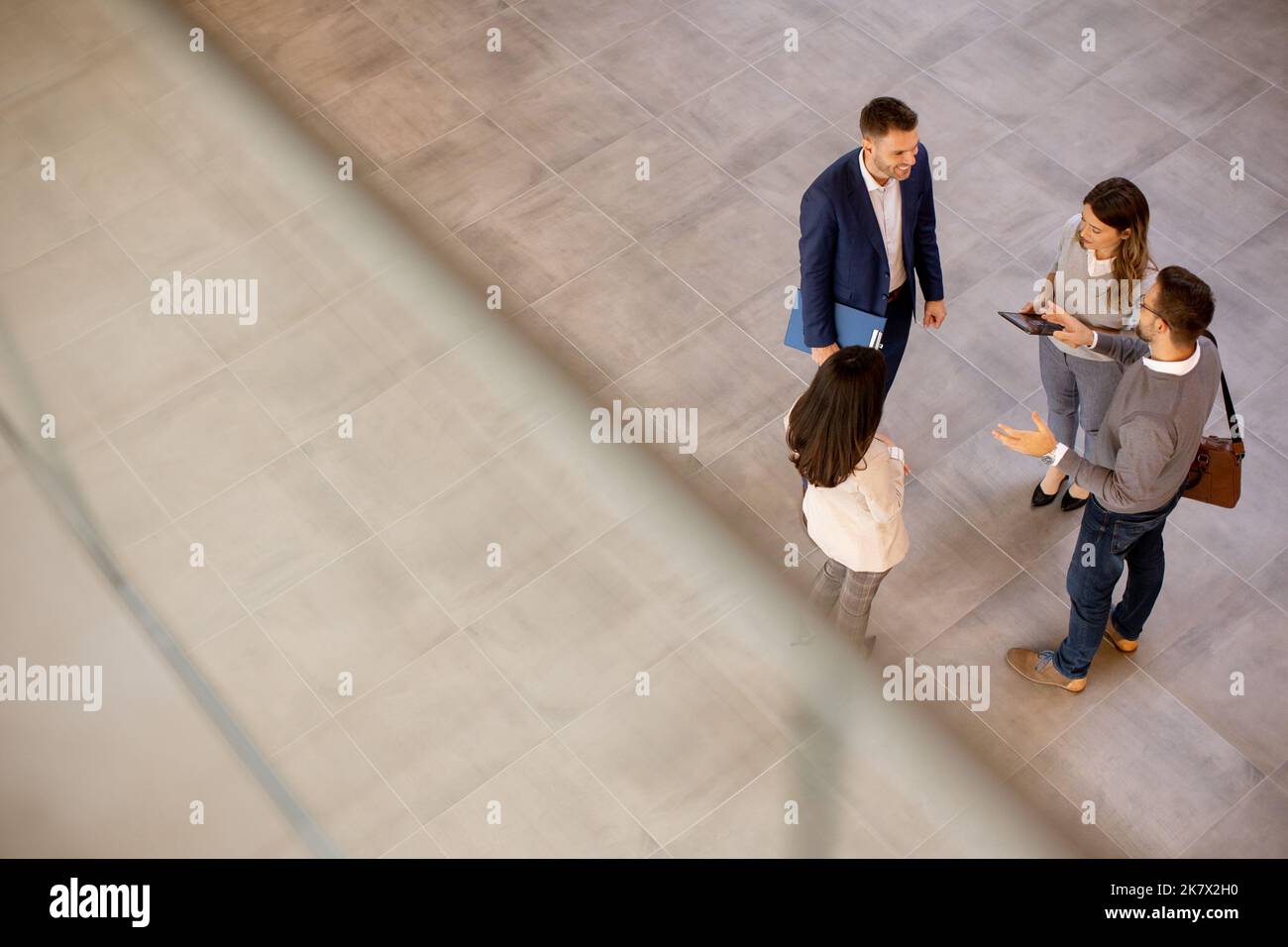 Four people talking aerial hi-res stock photography and images - Alamy