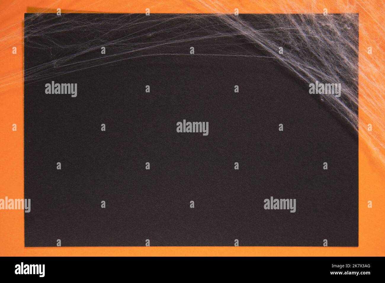 Orange and black paper background with cobwebs for Halloween Stock ...