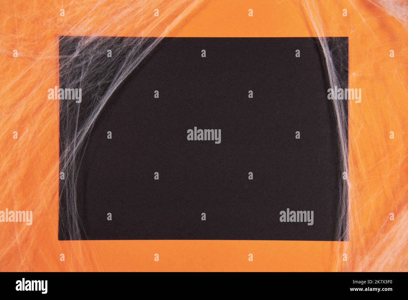 Orange and black paper background with cobwebs for Halloween Stock ...