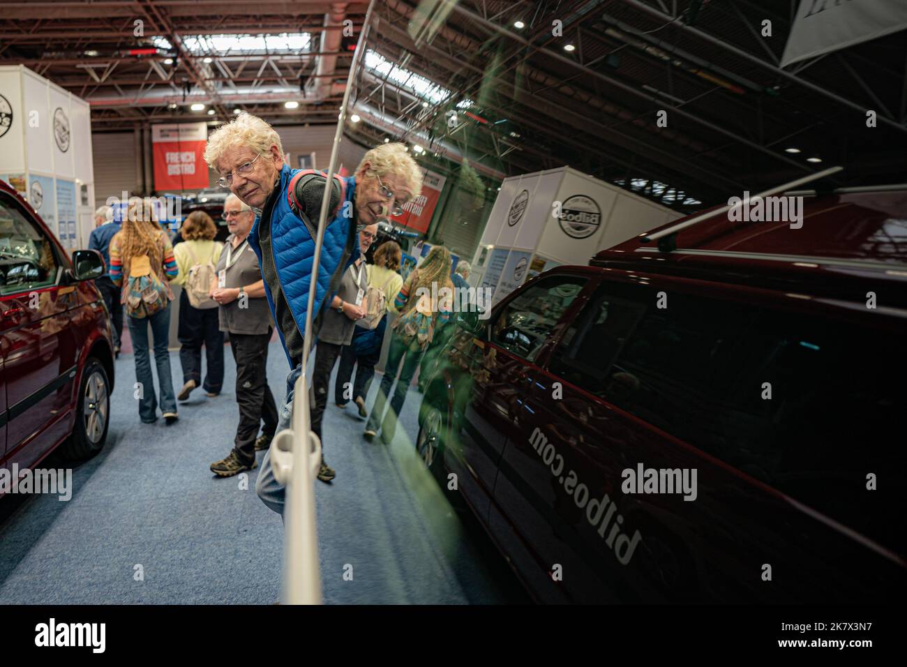 A man exits a campervan at the Motorhome & Caravan Show 2022 at the ...