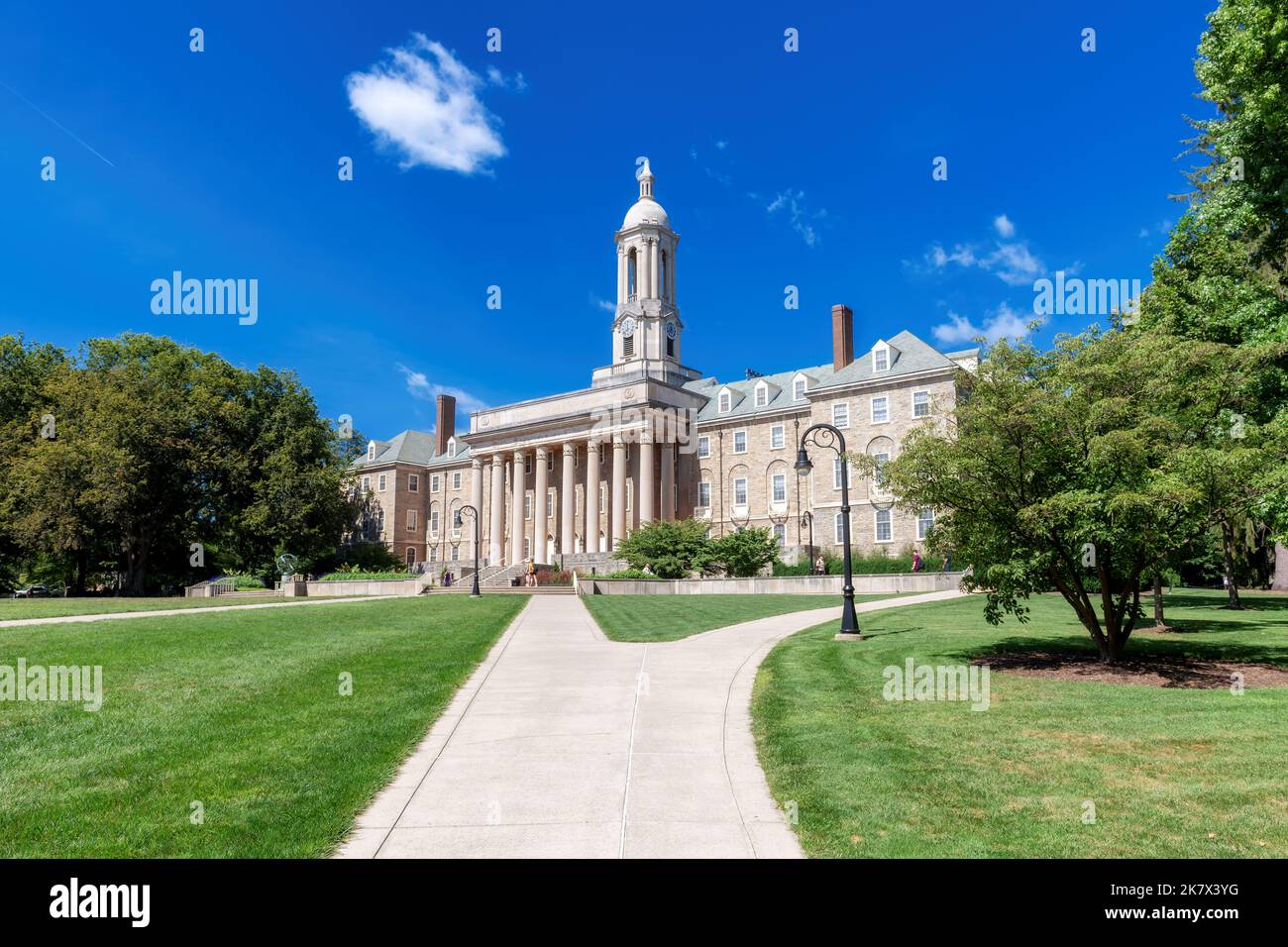 The Old Main building on the campus of Penn State University in sunny ...