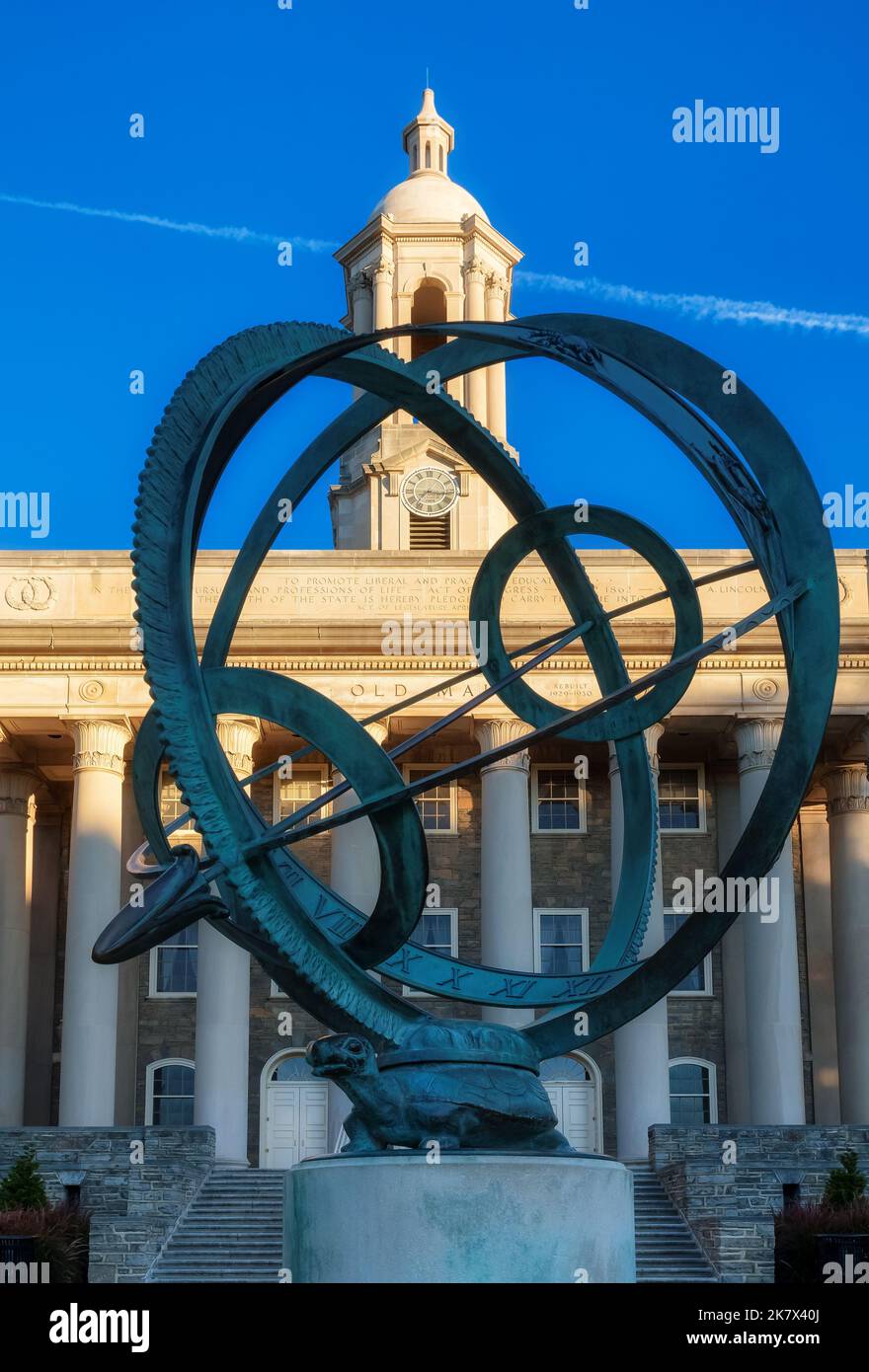 The Old Main building at sunrise on the campus of Penn State University ...