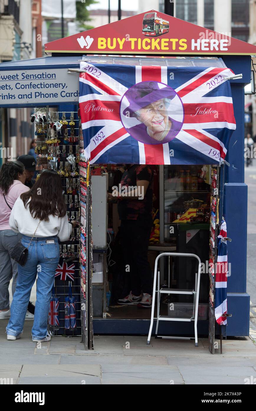 A Union flag featuring a portrait of Queen Elizabeth II is displayed at ...
