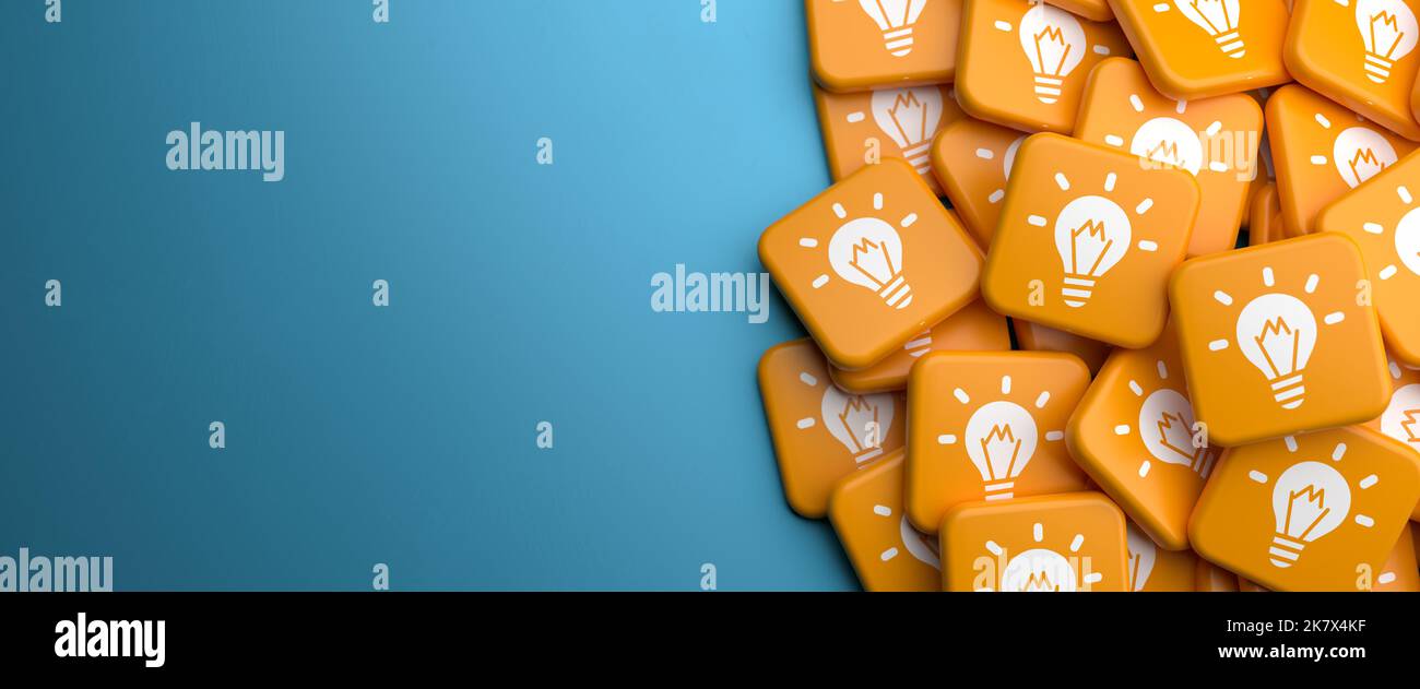 Creativity concept. Lightbulb logos with rays on a heap on a table. Copy space, web banner ...