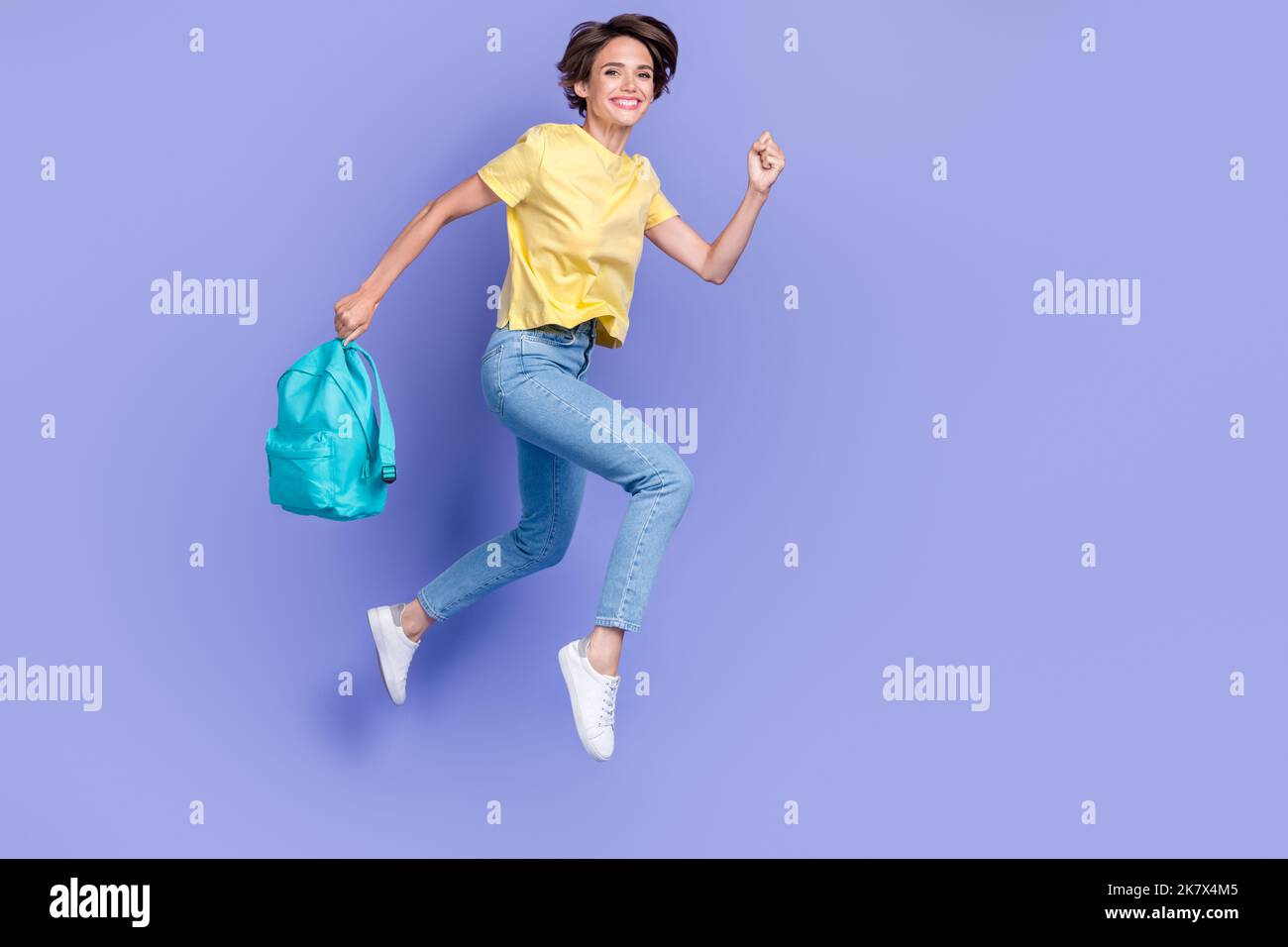 Full body portrait of excited energetic lady hold bag jumping running ...