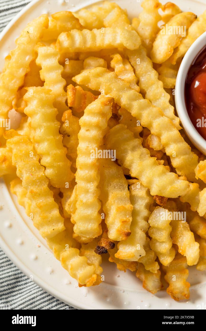 Homemade Crinkle Cut French Fries with Ketchup Stock Photo - Alamy