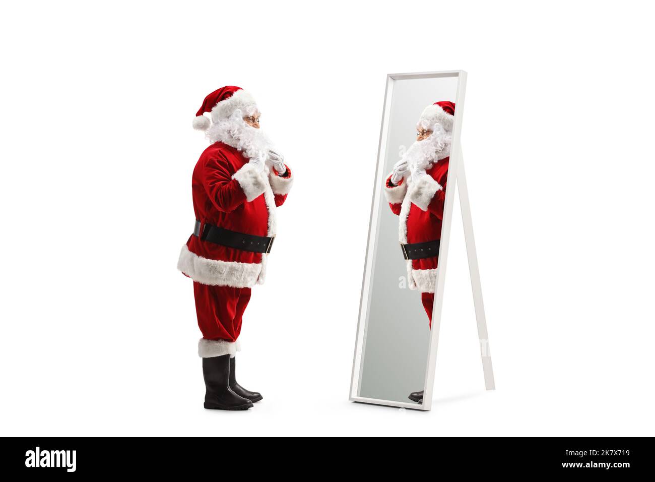 Full length profile shot of santa claus getting ready in front of a ...