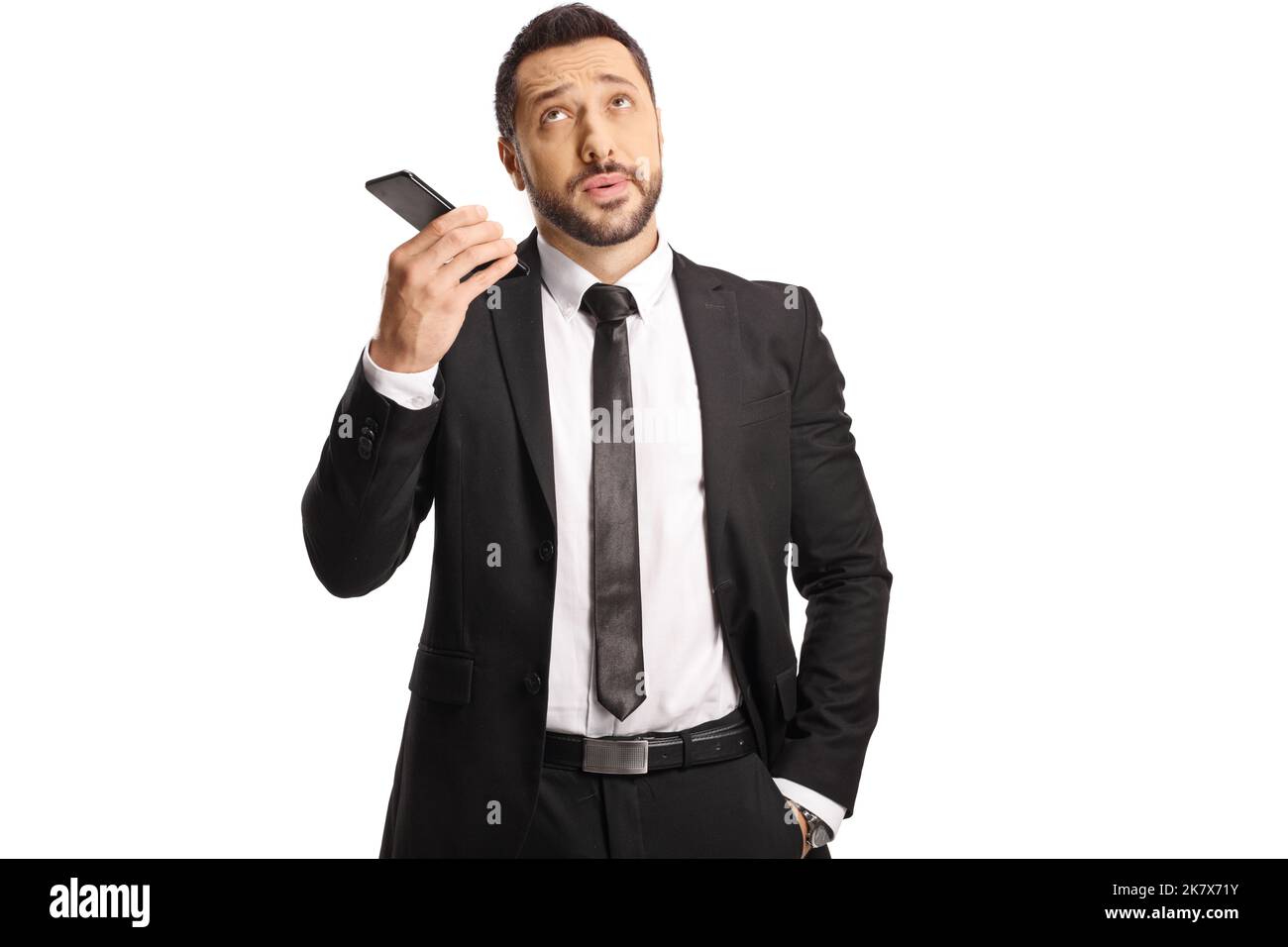 Bored businessman listening to phone conversation isolated on white ...