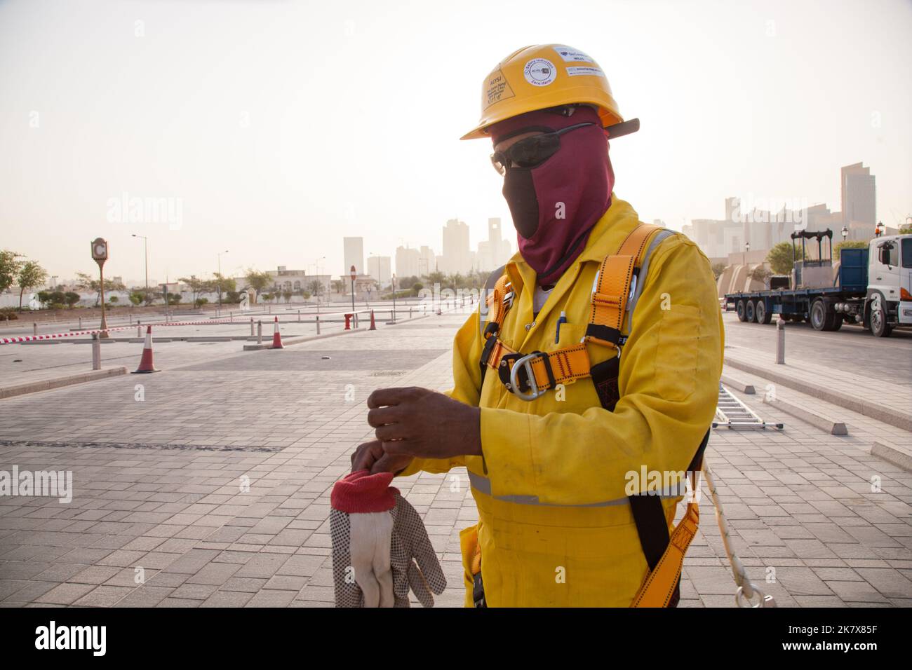 Doha, Qatar, December 18,2019 : Construction workers preparing a crane ...