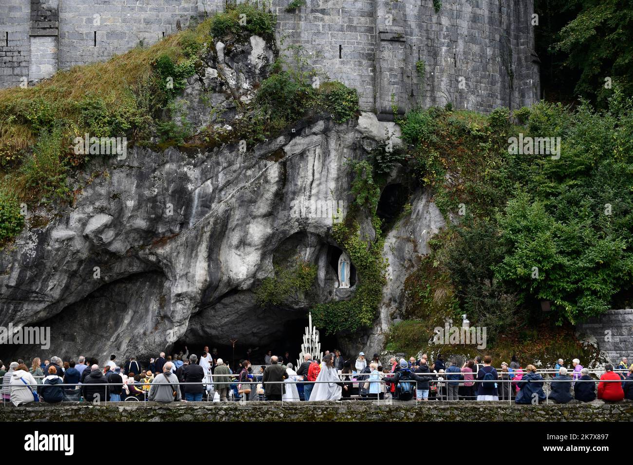 Lourdes, Hautes-Pyrénées, France. Priests taking mass at the entrance ...