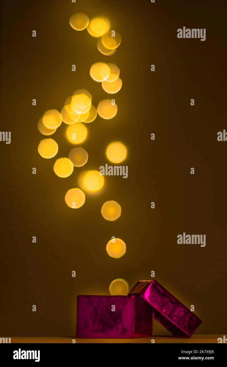 Open box from which magic lights come out Stock Photo - Alamy