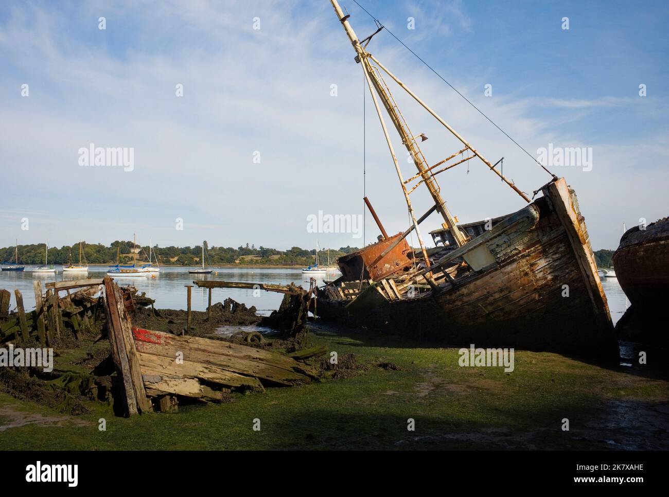 Old broken wooden sailing barges at Pin Mill on the river Orwell in ...