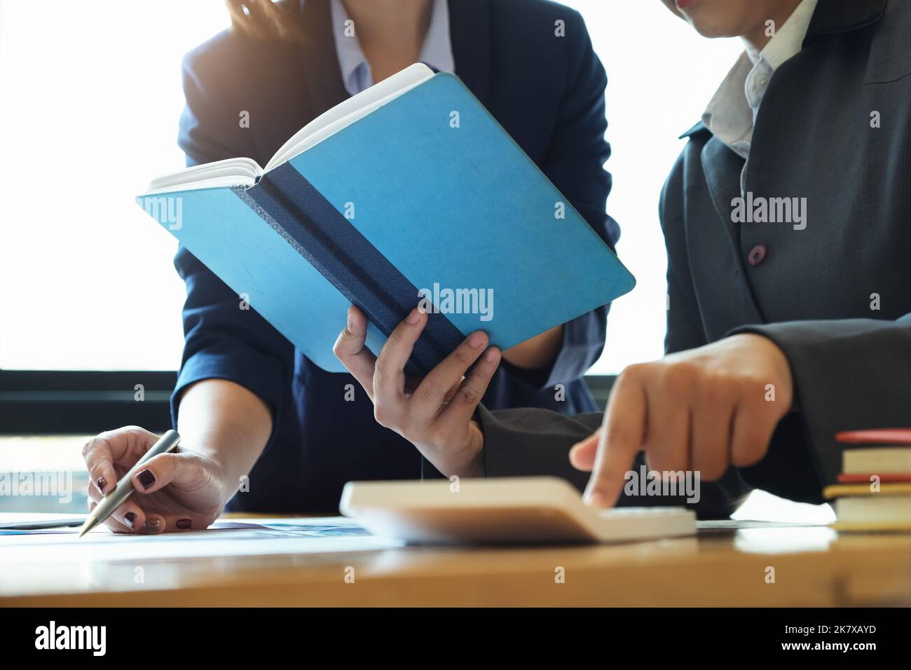 Business consultants using notebook with explaining statistics graphs ... Business consultants using notebook with explaining statistics graphs ...