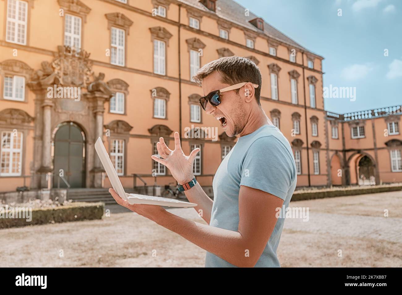 Angry and frustrated male student checks the results of failed ...