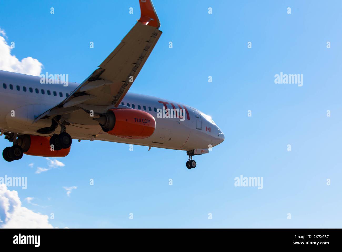 Airplane from the travel agency TUI on approach for landing. Blue sky ...