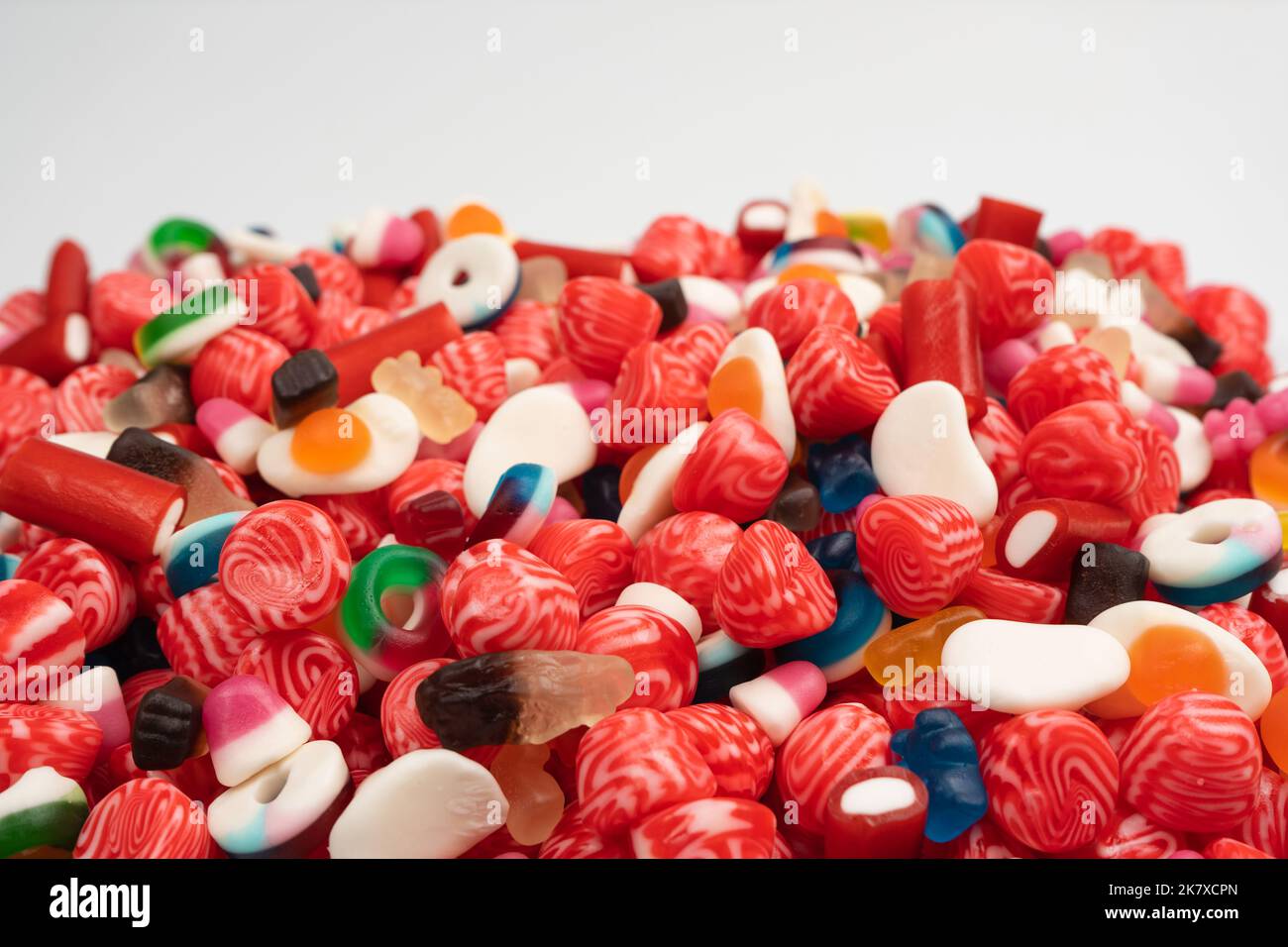 Tasty mix of jelly colorful candies isolated on a white background ...