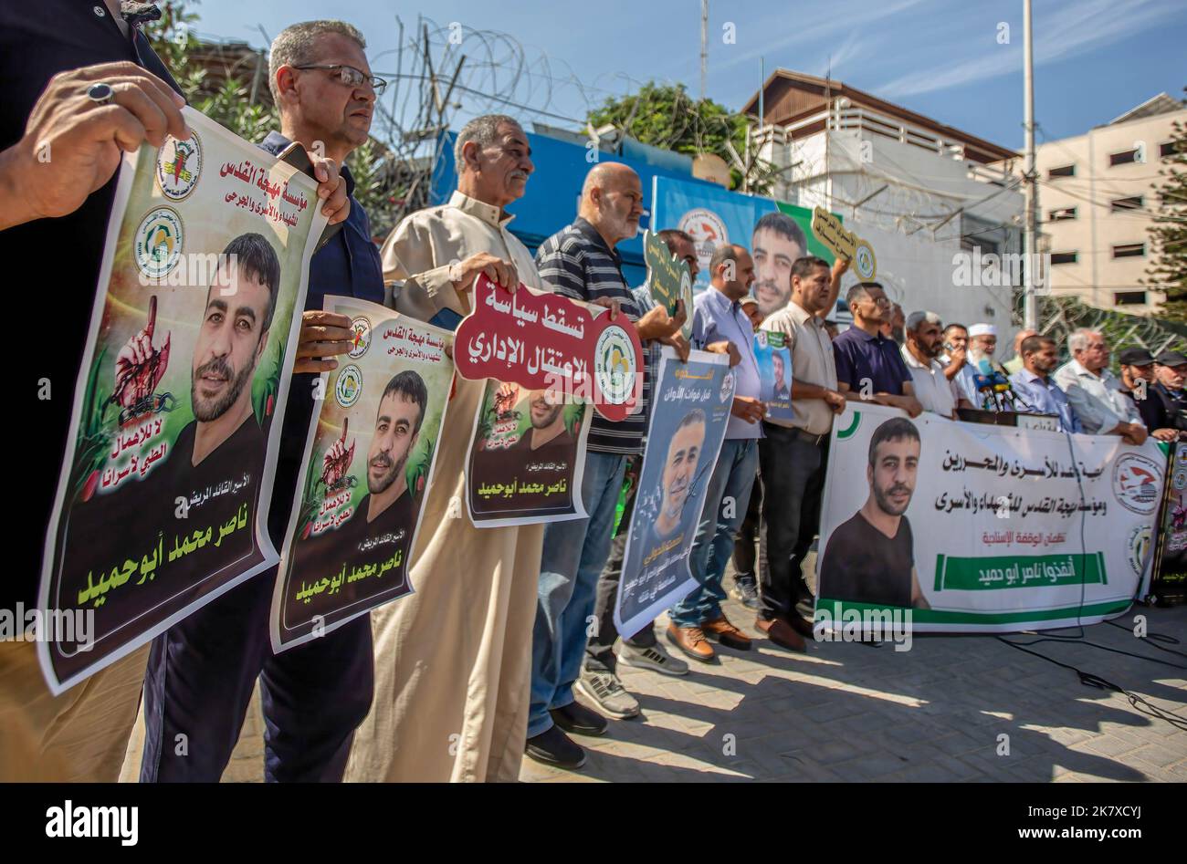 Gaza, Palestine. 19th Oct, 2022. Angry Palestinians hold portraits of ...