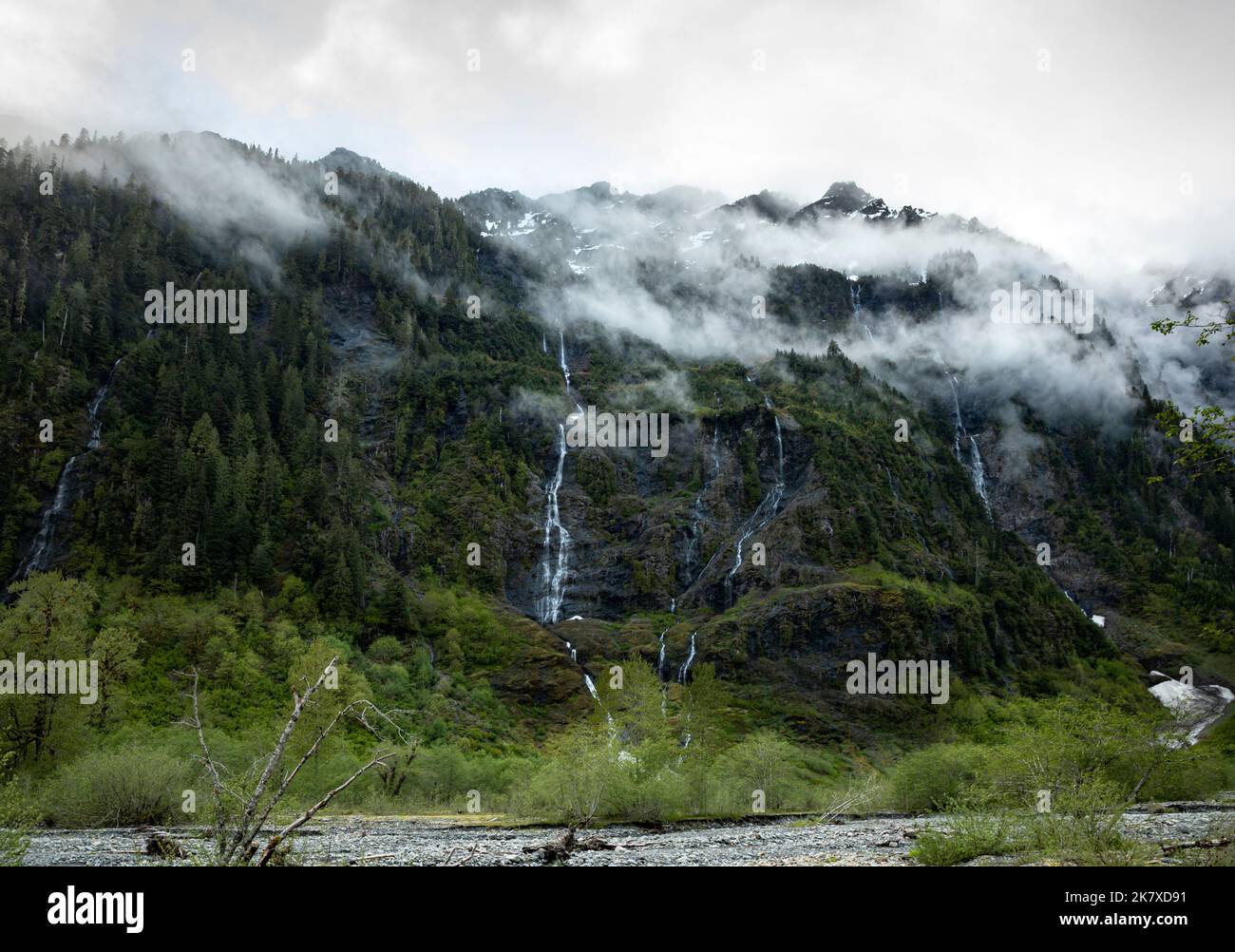 WA22384-00...WASHINGTON - Clouds pouring over the moiuntains above the ...