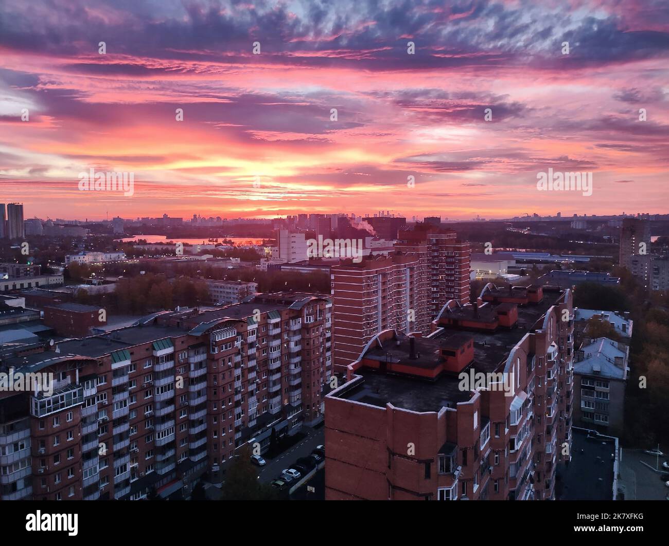 Residential building in sunset. Apartment building and suburb house ...
