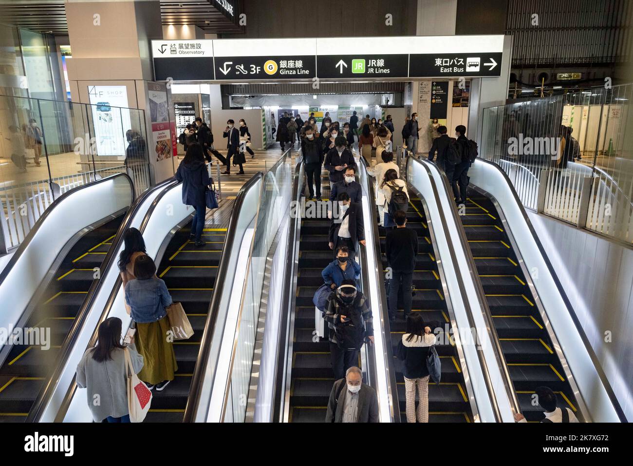Tokyo, Japan. 19th Oct, 2022. Commuters going down an escalator to ...