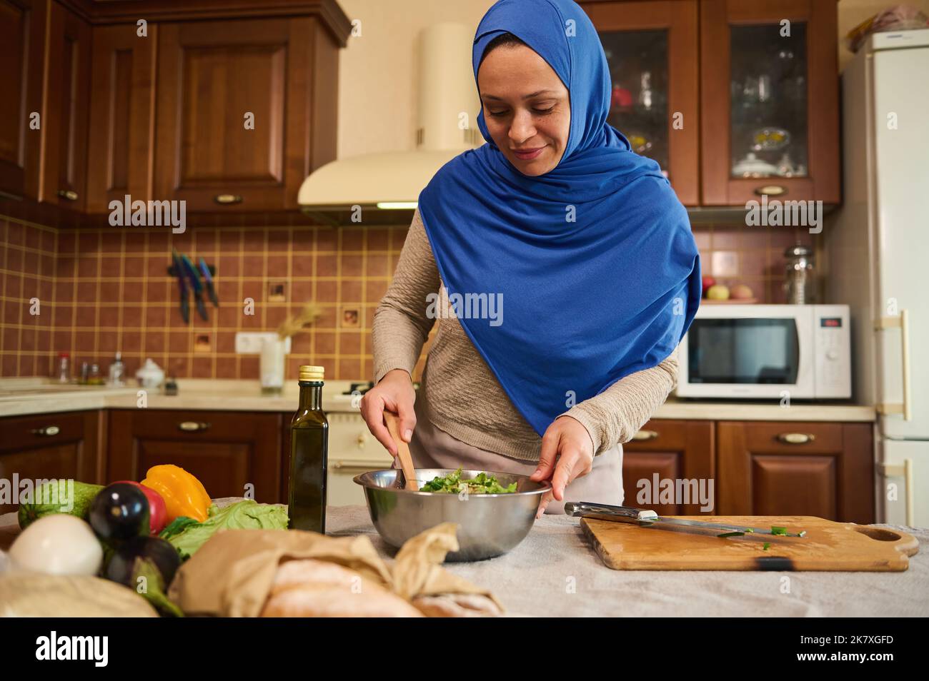 Arab Muslim beautiful woman, pleasant housewife in blue hijab ...