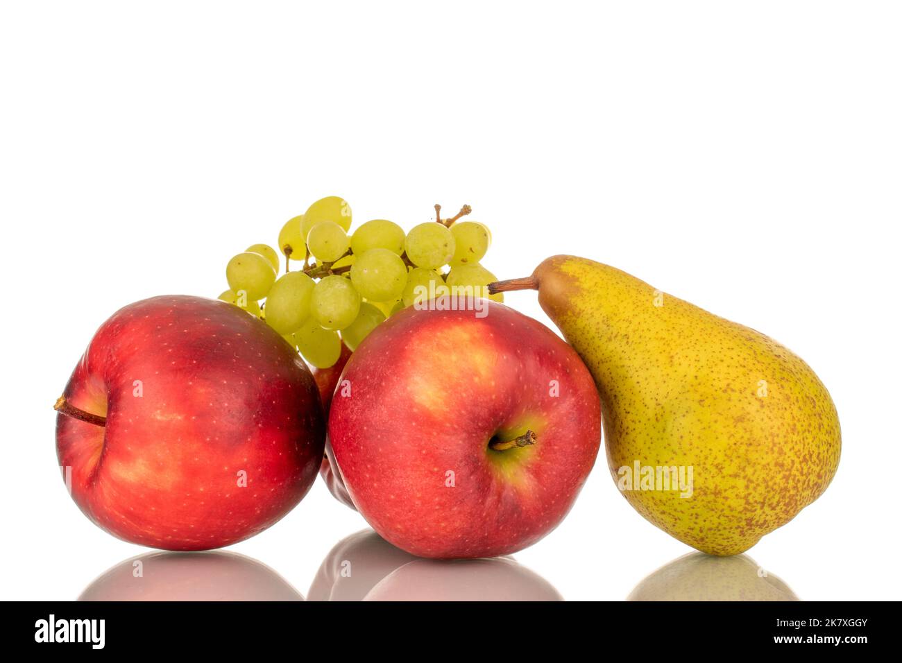 Two red apples, pear and grapes, macro, isolated on white background ...