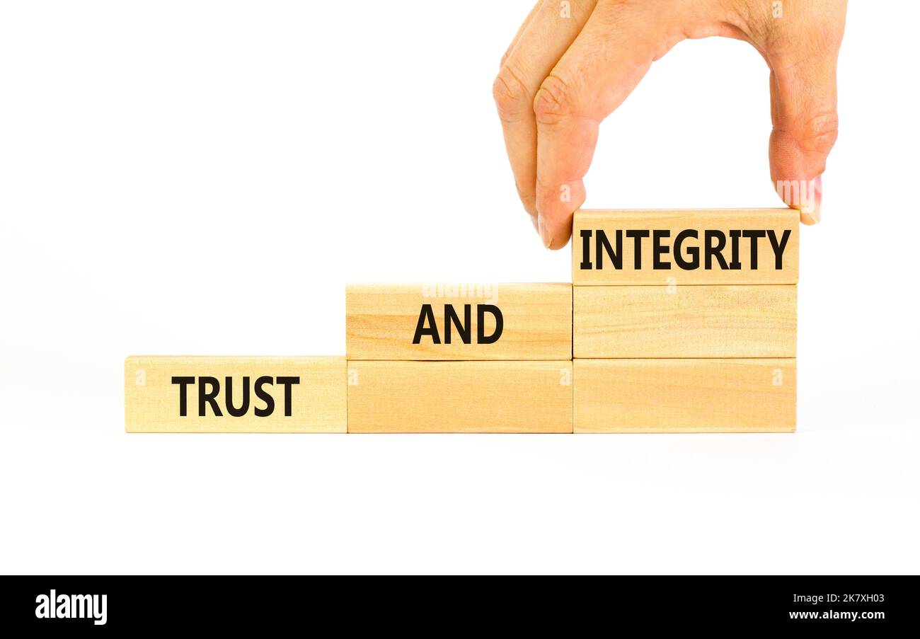Trust and integrity symbol. Concept words Trust and integrity on wooden ...