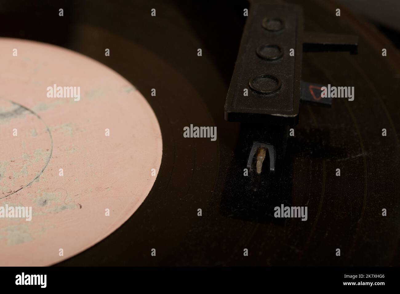 Vintage vinyl record player. The vinyl record is spinning. Close-up ...