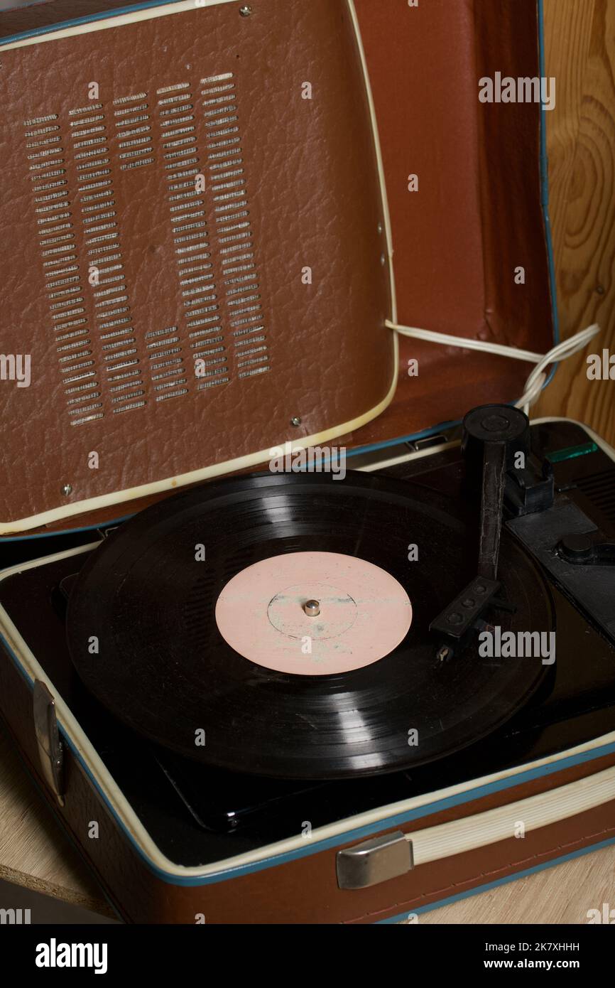 Vintage vinyl record player. The vinyl record is spinning. Close-up ...